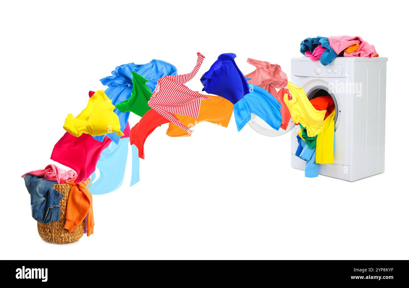 Clean colorful clothes flying out of washing machine into laundry ...