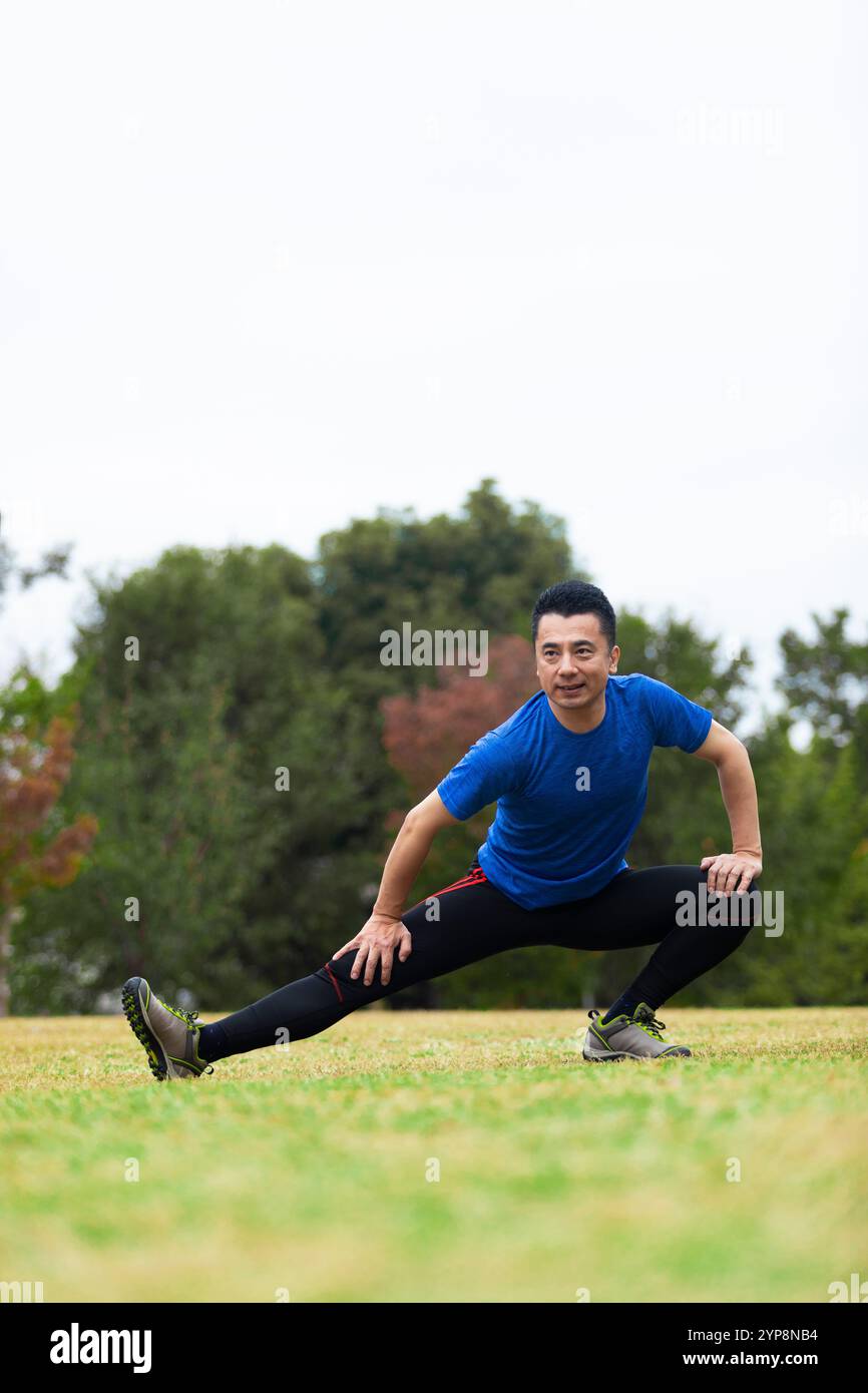 Middle men doing preparatory exercises Stock Photo - Alamy