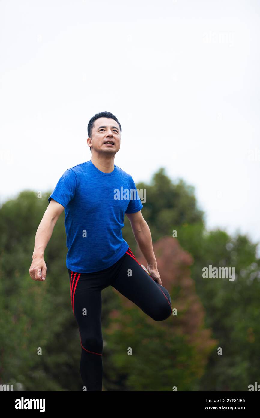 Middle men doing preparatory exercises Stock Photo - Alamy