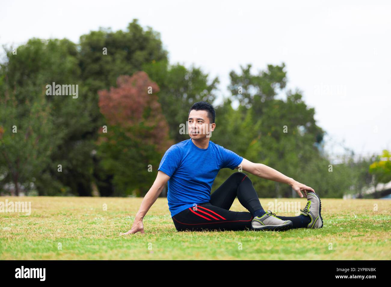 Middle men doing preparatory exercises Stock Photo - Alamy