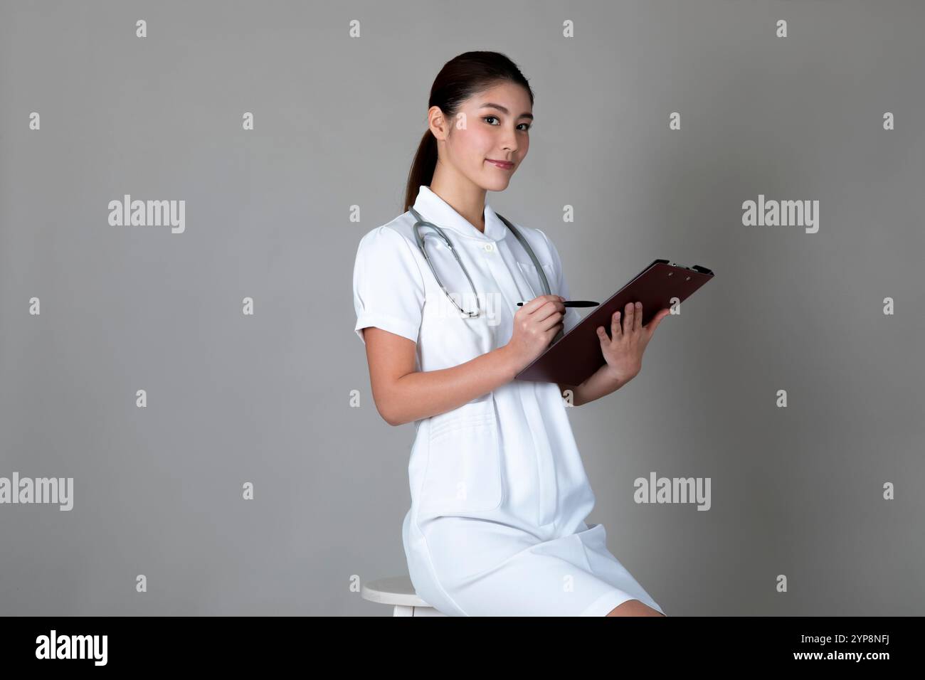 Woman in nurse's uniform Stock Photo - Alamy