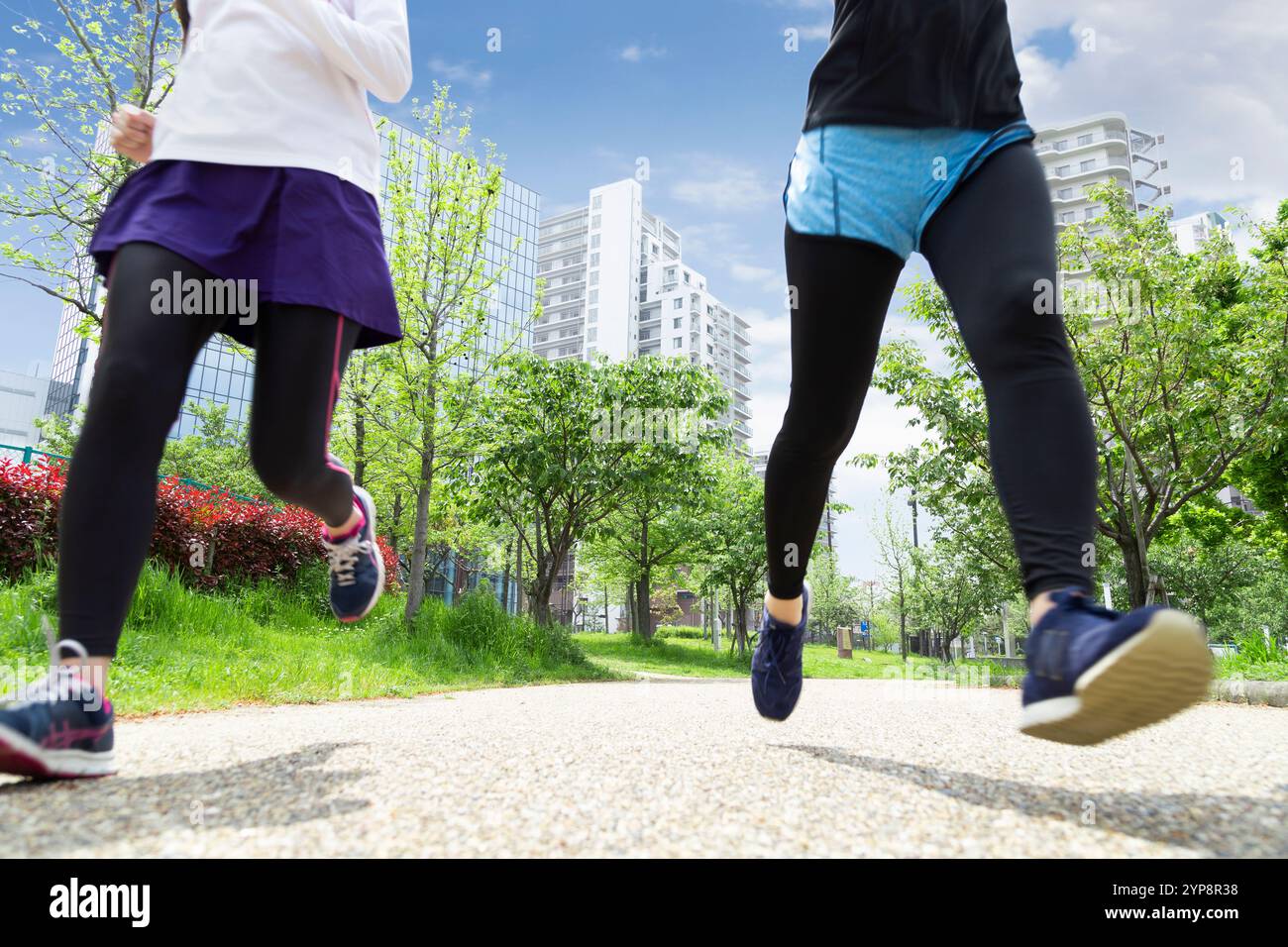 Two running women hi-res stock photography and images - Alamy