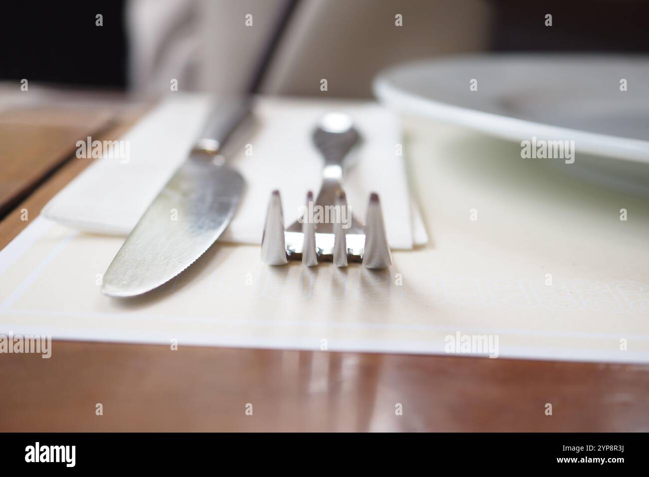 An Elegant Table Setting Featuring a Fork and Knife for Dining That ...
