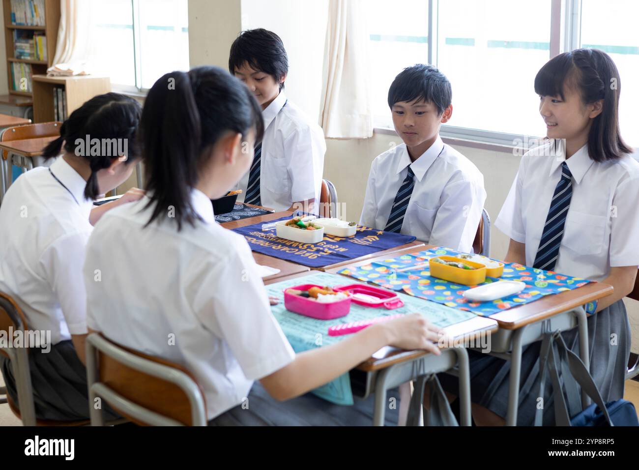 Junior high school student eating lunch Stock Photo - Alamy