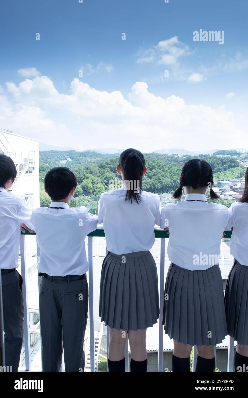 Secondary school children lined up on balcony Stock Photo - Alamy
