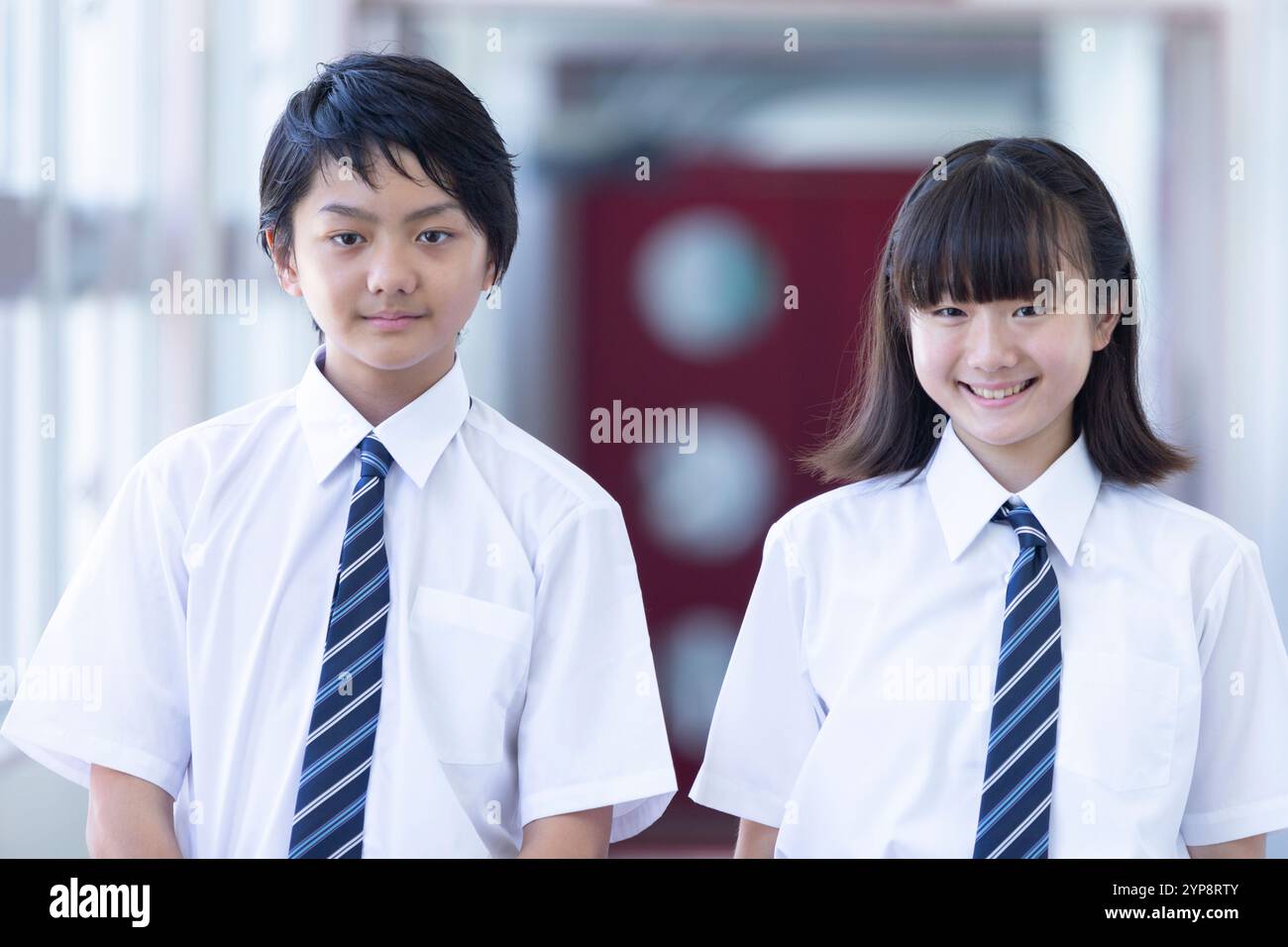 Junior high school students standing in line in corridor Stock Photo ...