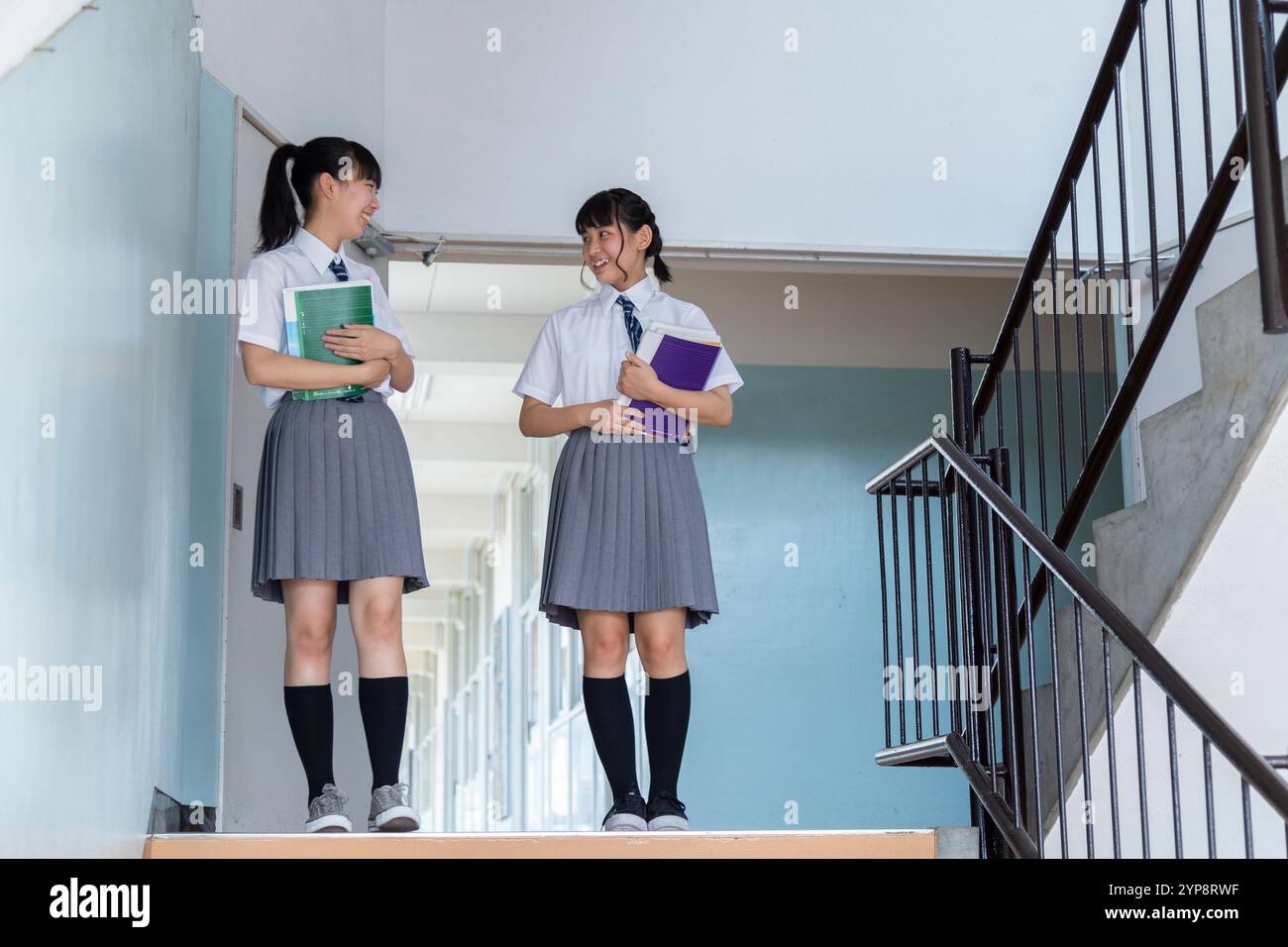Junior high school students moving to the classroom Stock Photo - Alamy