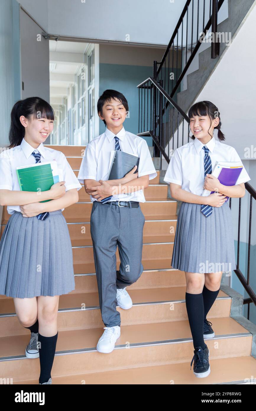 Junior high school student descending stairs Stock Photo - Alamy