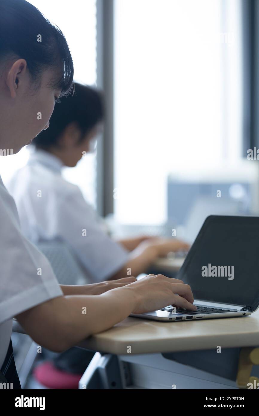 Junior high school pupils in class Stock Photo - Alamy