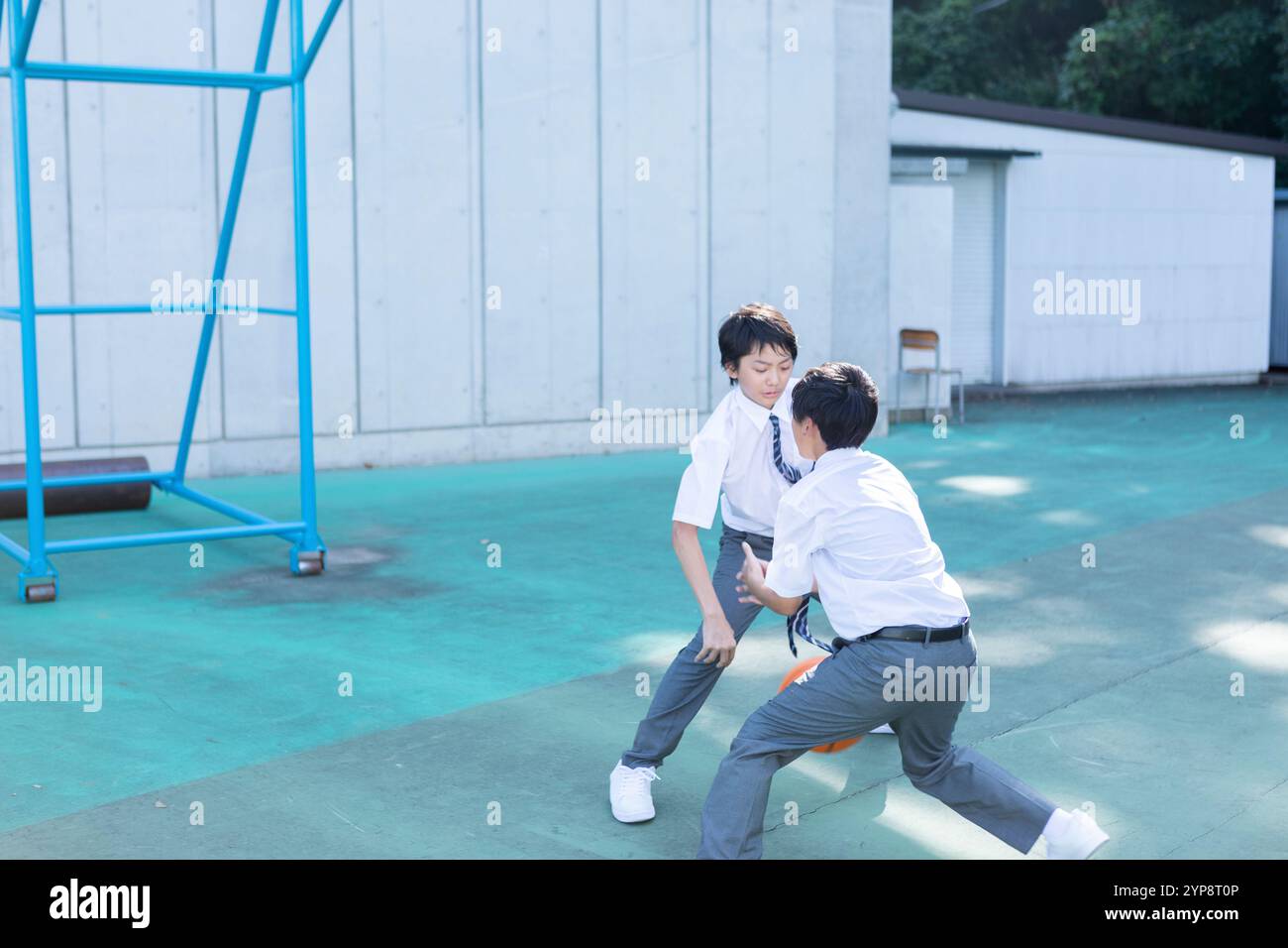 Secondary school students playing basketball Stock Photo - Alamy
