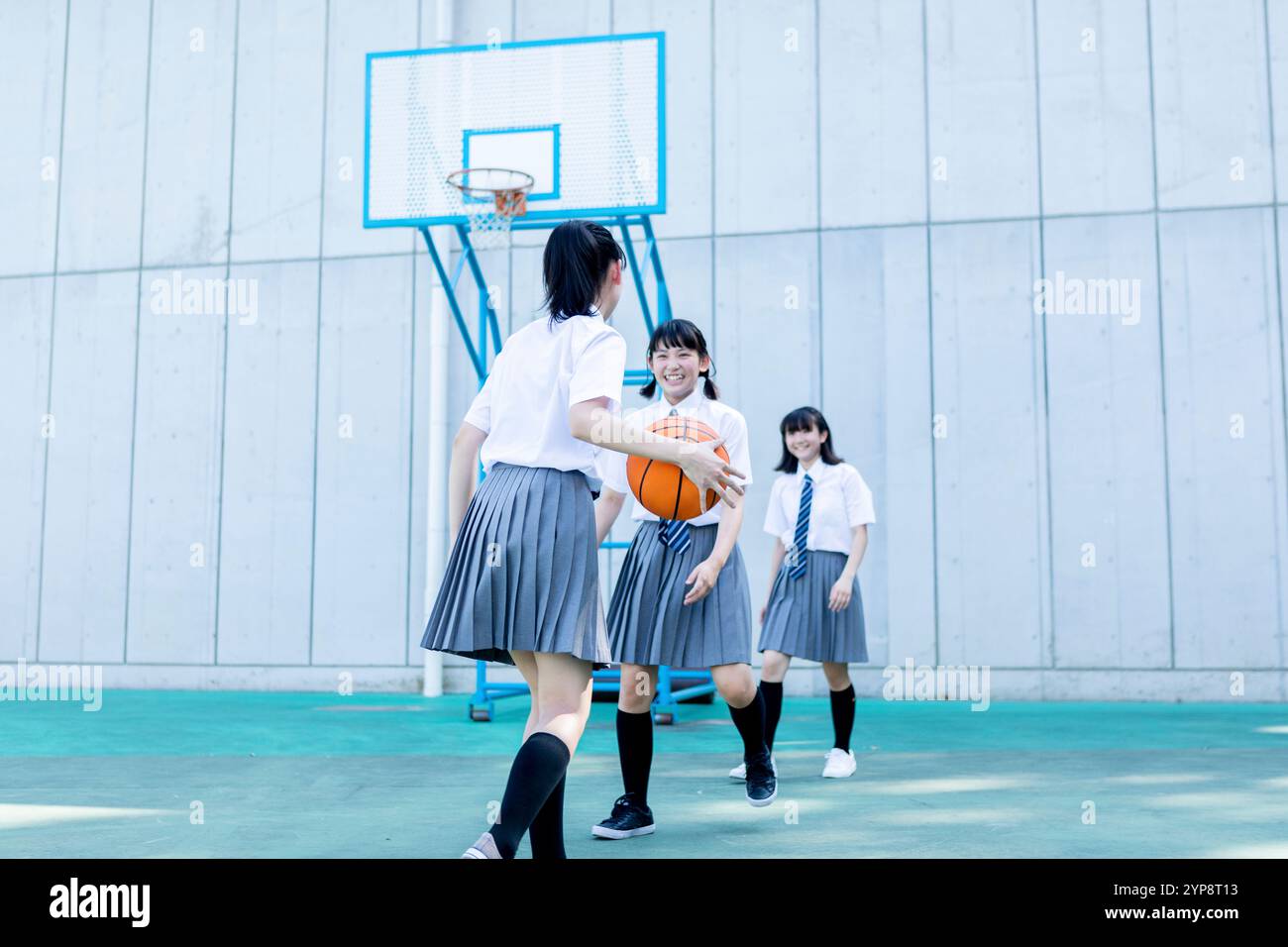 Secondary school students playing basketball Stock Photo - Alamy