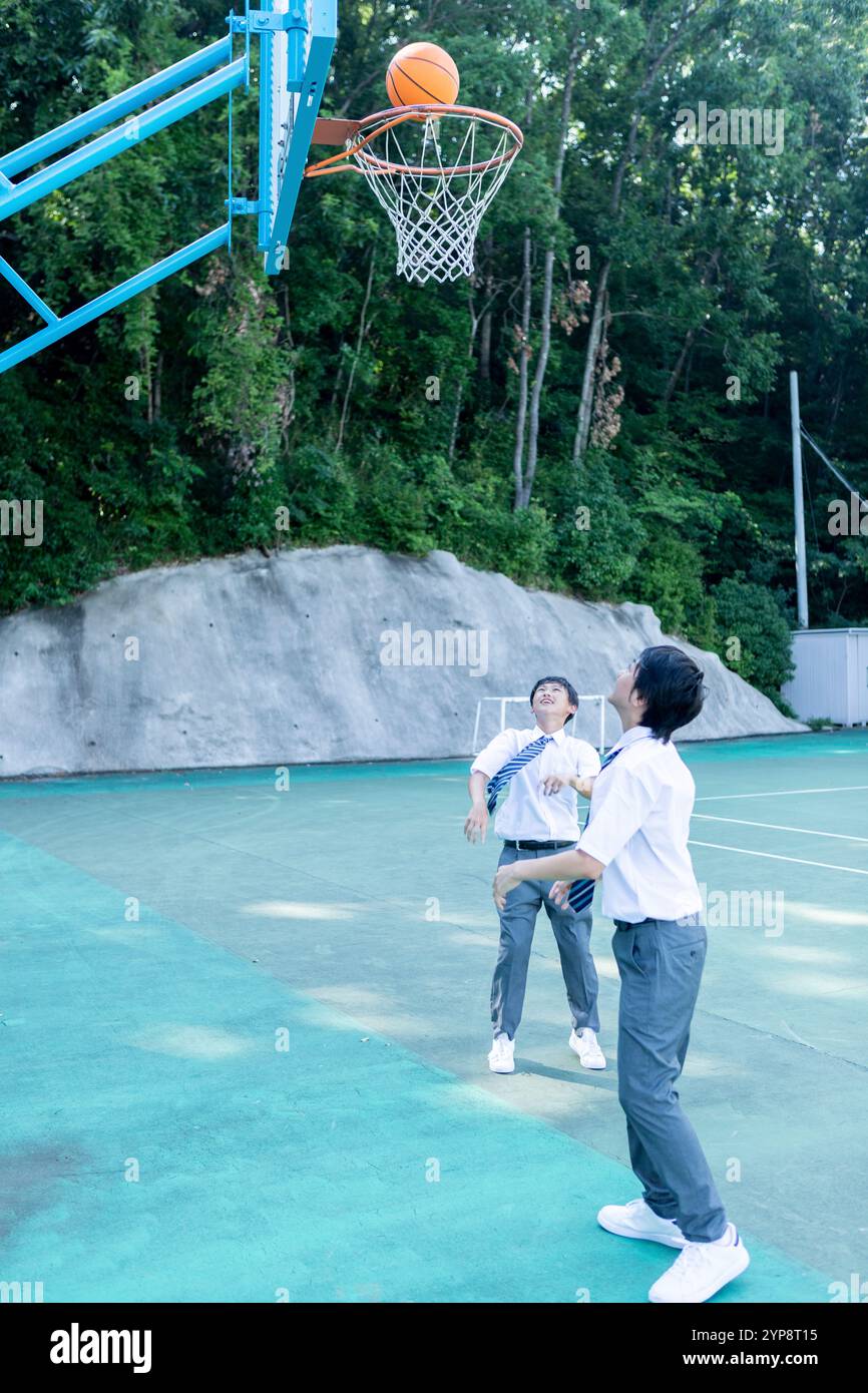 Secondary school students playing basketball Stock Photo - Alamy