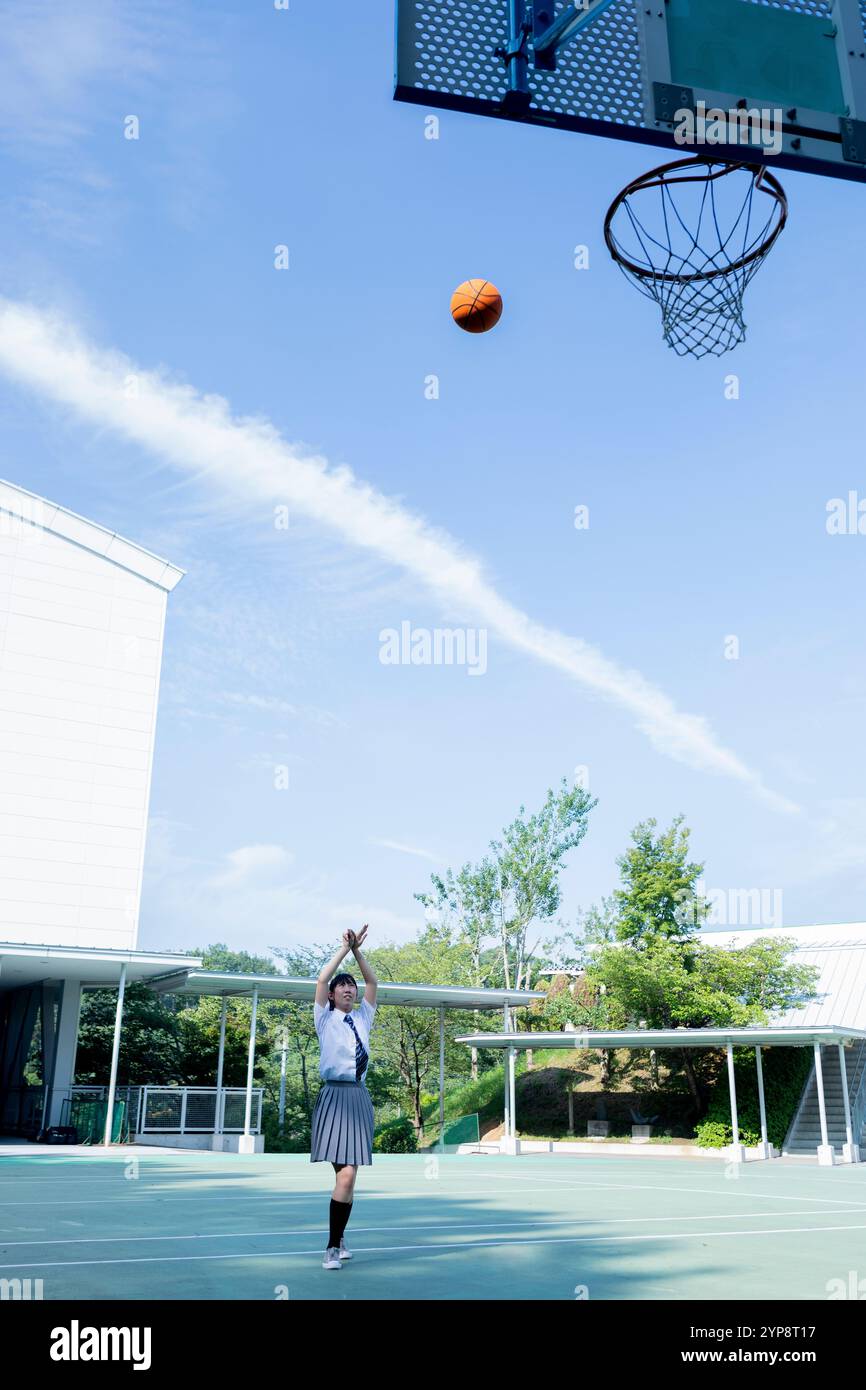 Secondary school students playing basketball Stock Photo - Alamy