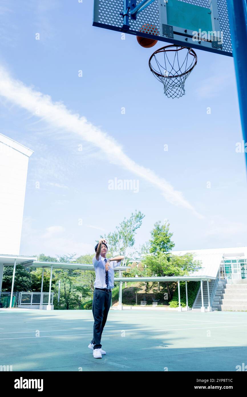 Secondary school students playing basketball Stock Photo - Alamy