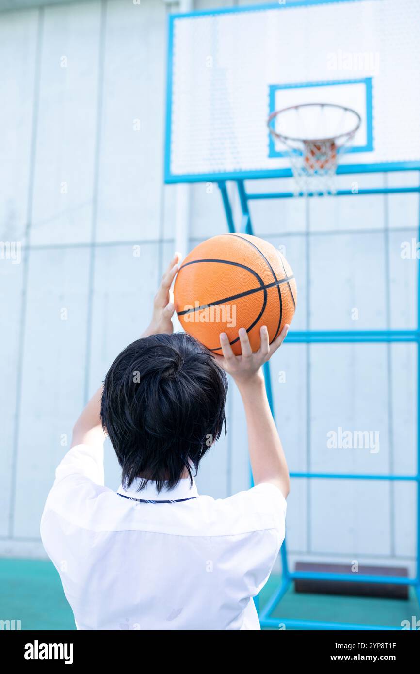 Secondary school students playing basketball Stock Photo - Alamy