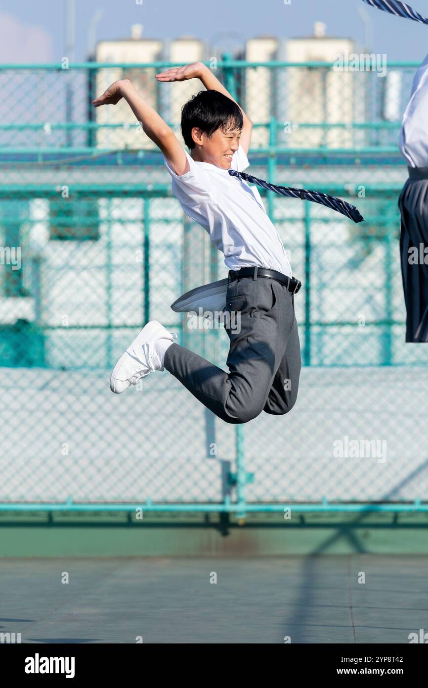 Junior high school students on rooftop Stock Photo - Alamy