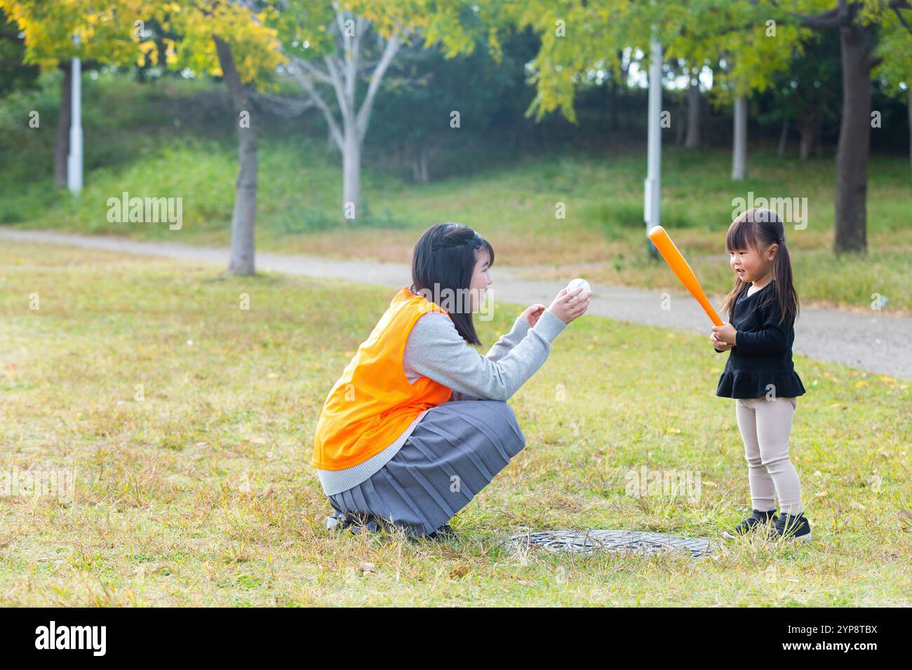 High school students playing with children Stock Photo - Alamy