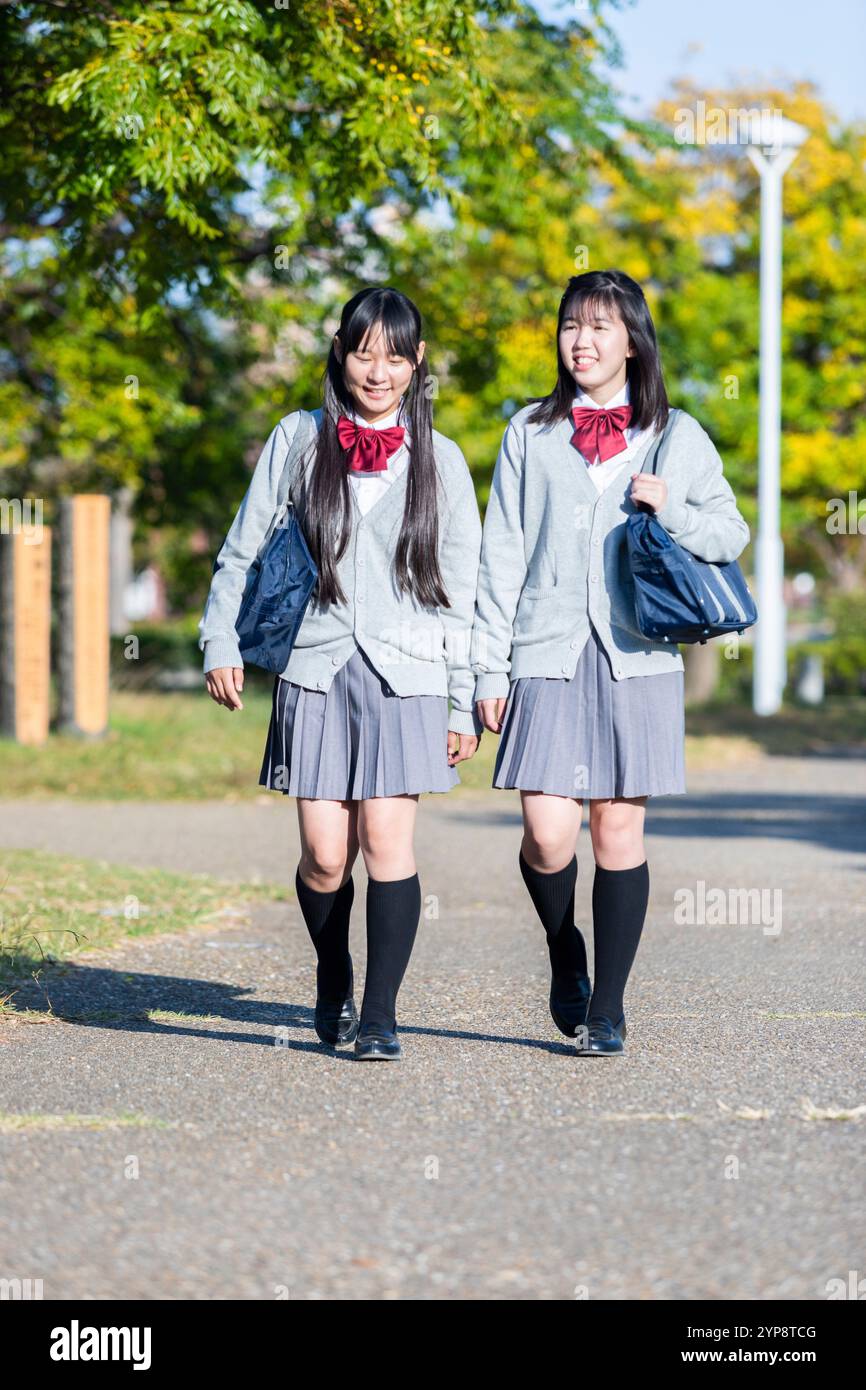High school students leaving school Stock Photo - Alamy