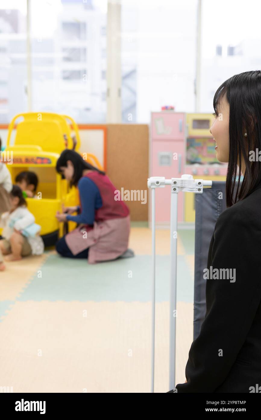 Mother watching child playground hi-res stock photography and images ...
