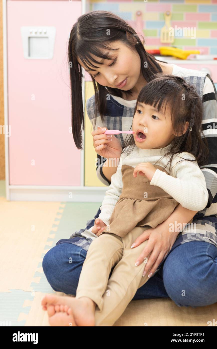 Teaching tooth brushing Stock Photo - Alamy