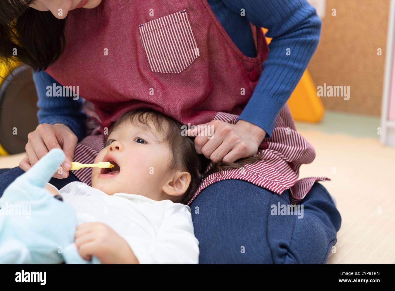 Teaching tooth brushing Stock Photo - Alamy