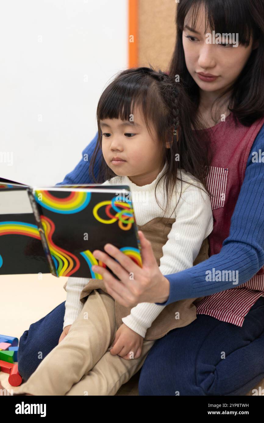 Pupil reading book hi-res stock photography and images - Alamy