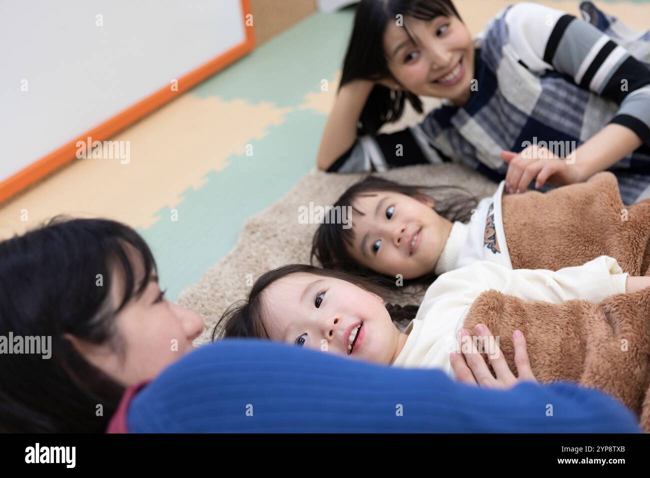 Nursery school children taking a nap Stock Photo - Alamy