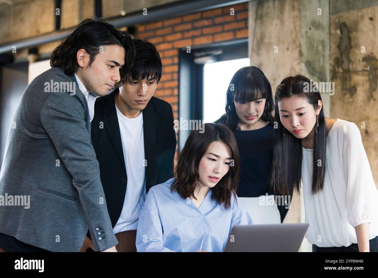 Group of people surround computer hi-res stock photography and images ...