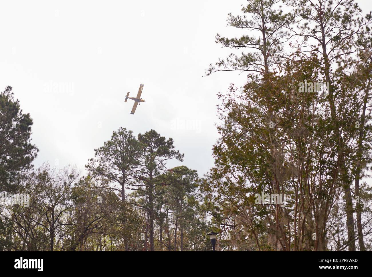 Aerial Tractor crop dusting farming acreage in rural southern Georgia ...