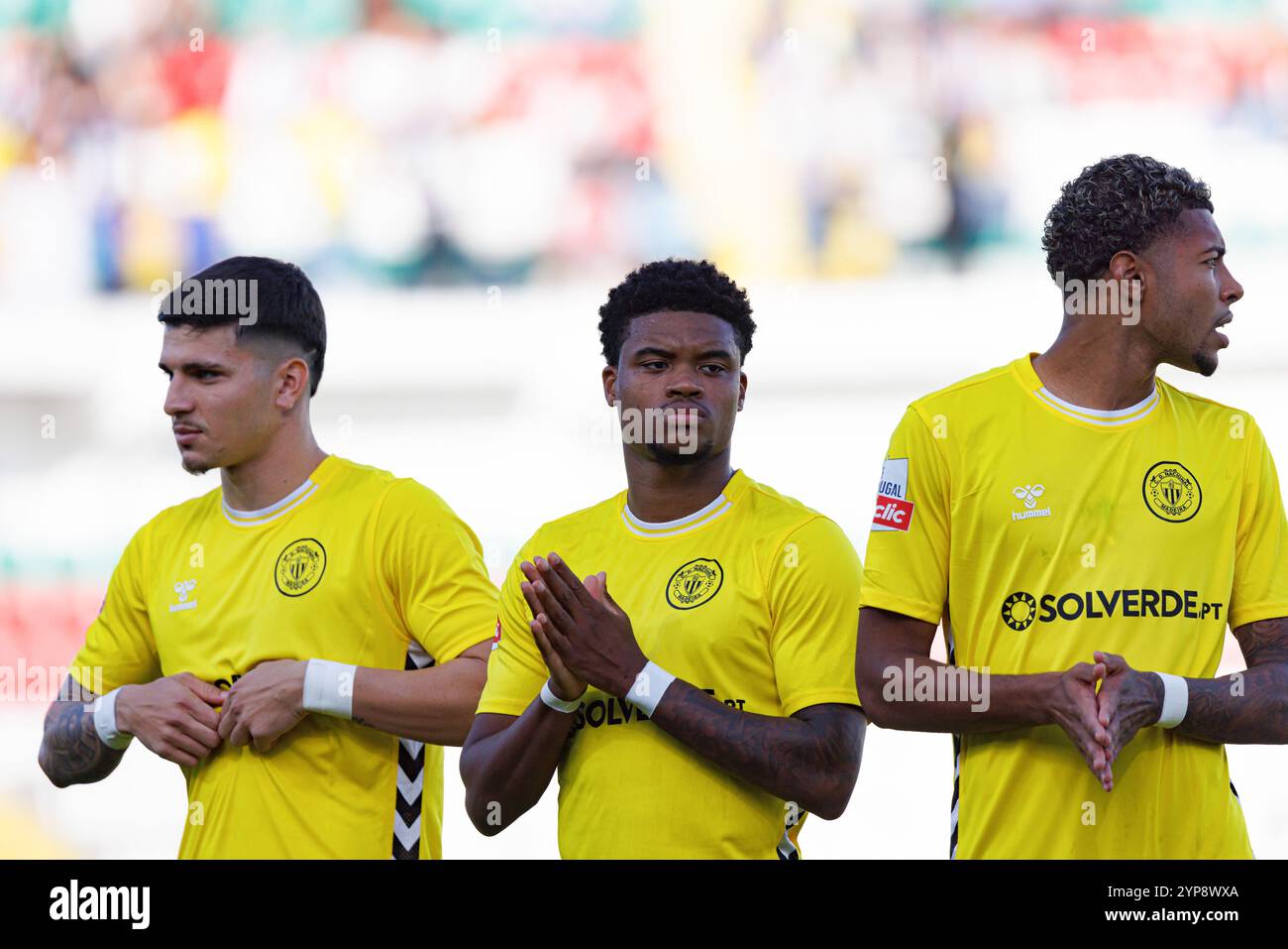 Nigel Thomas (C) and Matheus Dias (R) (CD Nacional) seen during the ...