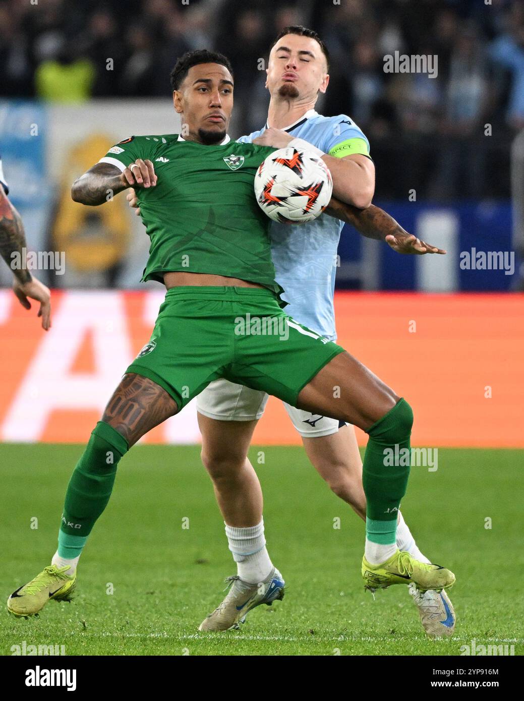 Rome, Italy. 28th Nov, 2024. Lazio's Patric (R) vies with Ludogorets ...