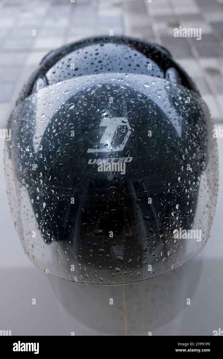 Wet motorcycle helmet because of rain Stock Photo - Alamy