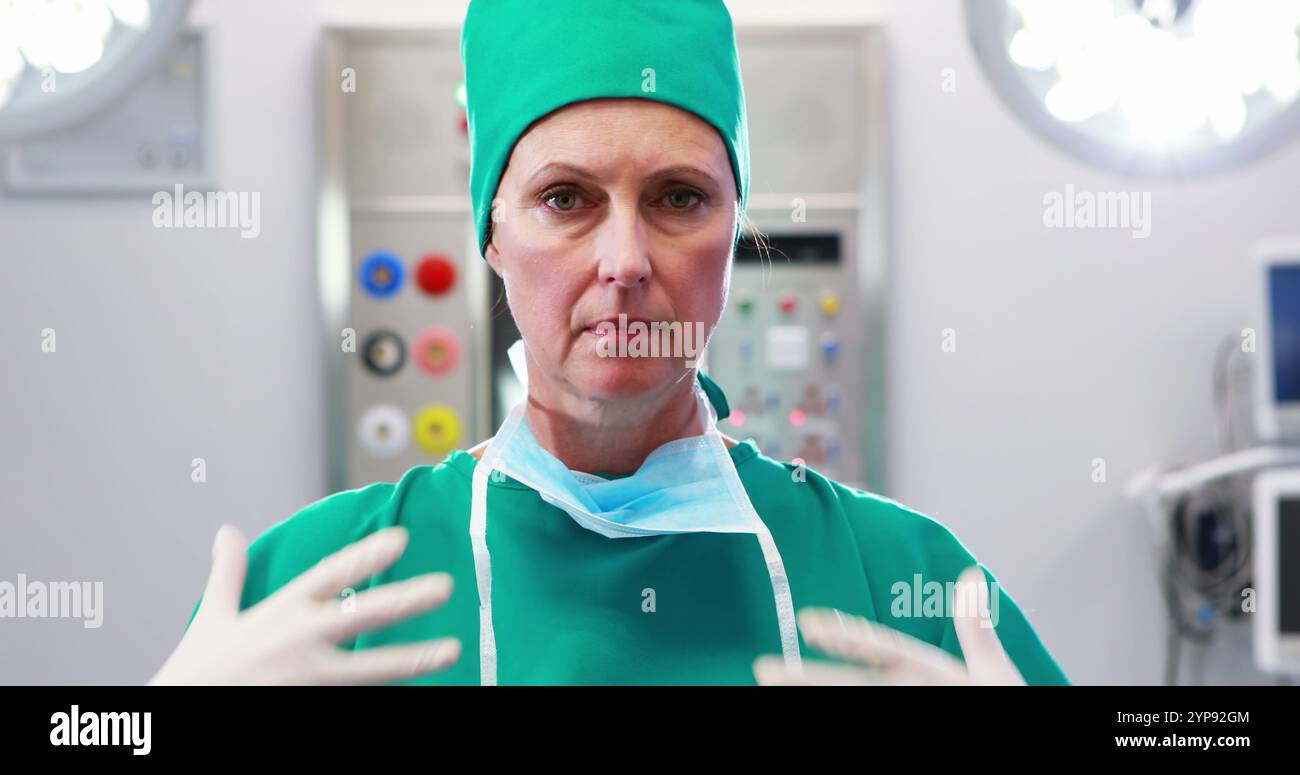 Female nurse tying surgical mask in operation theater at hospital Stock ...