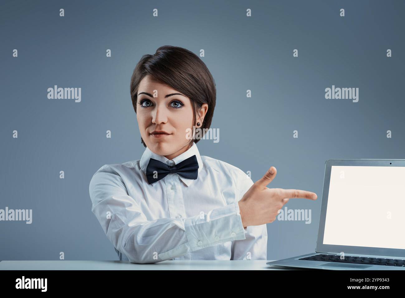 Confident young businesswoman presenting innovative ideas at desk with ...