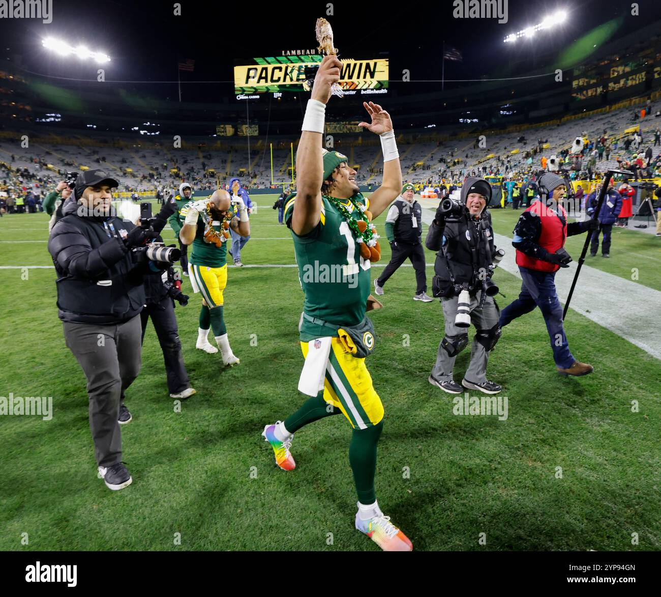 Green Bay Packers quarterback Jordan Love (10) reacts with a turkey leg ...