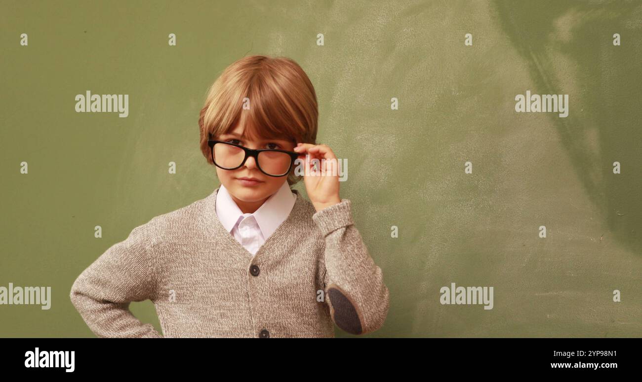 Cute pupil pretending to be teacher in classroom Stock Photo - Alamy