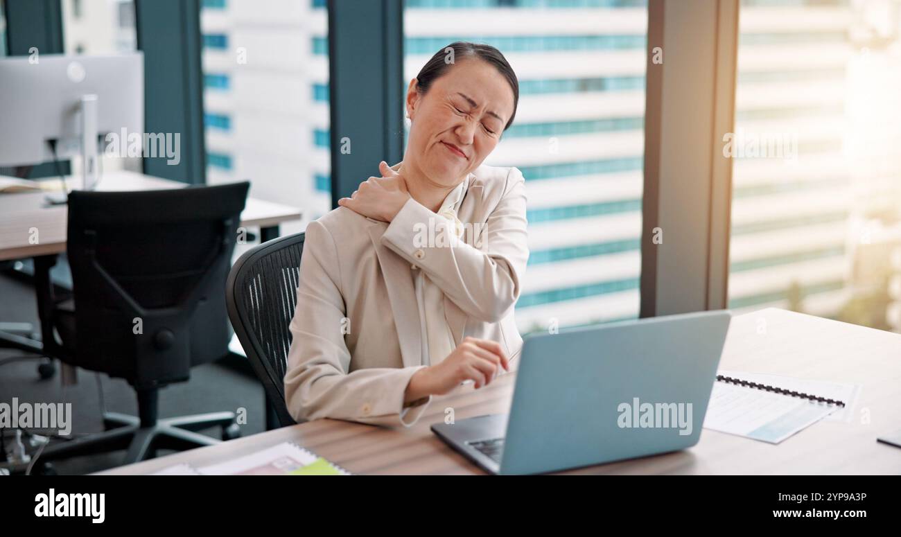 Asian woman, shoulder pain and stress with laptop for injury, pressure ...