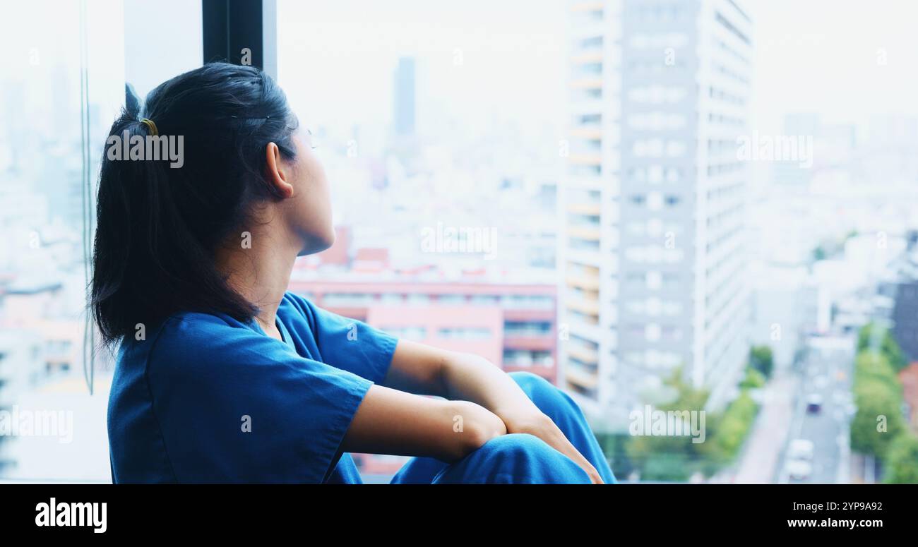 Thinking, window and nurse in hospital sad for crisis, surgery fail and ...