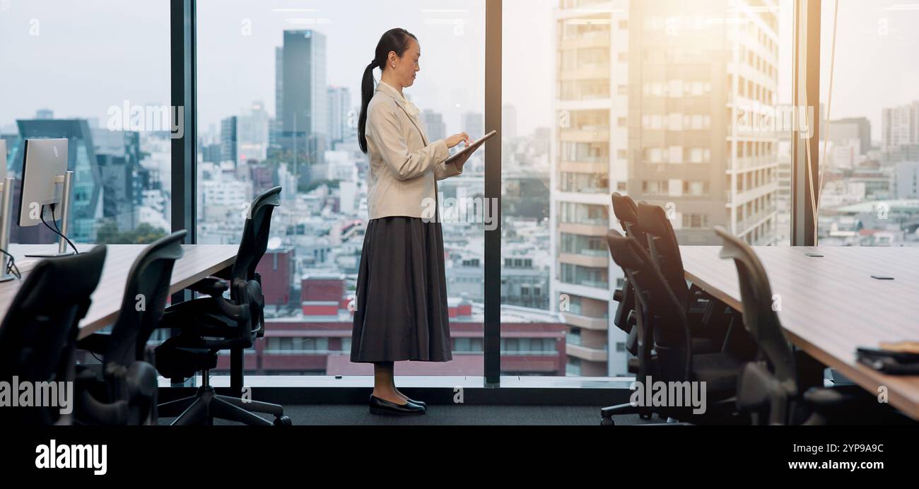 Japan, accountant and woman in office, tablet and typing with internet ...