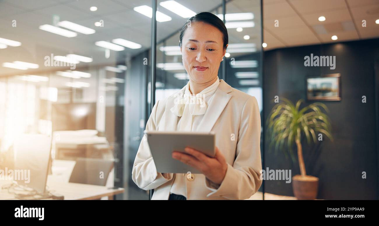 Japan, finance and woman in office, tablet and typing with internet ...