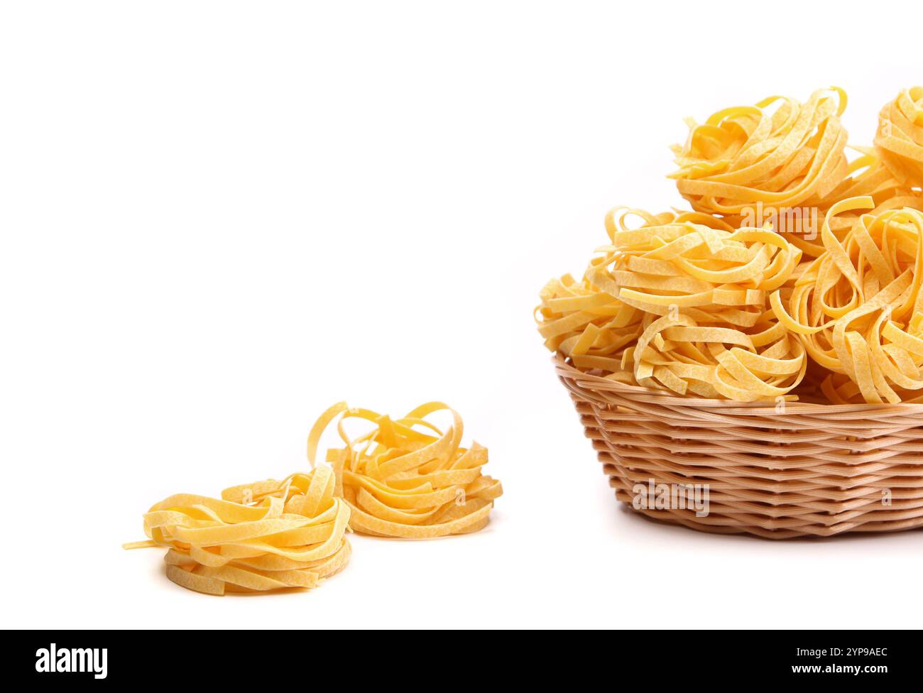 Tagliatelle paglia e fieno at basket. White background Stock Photo - Alamy