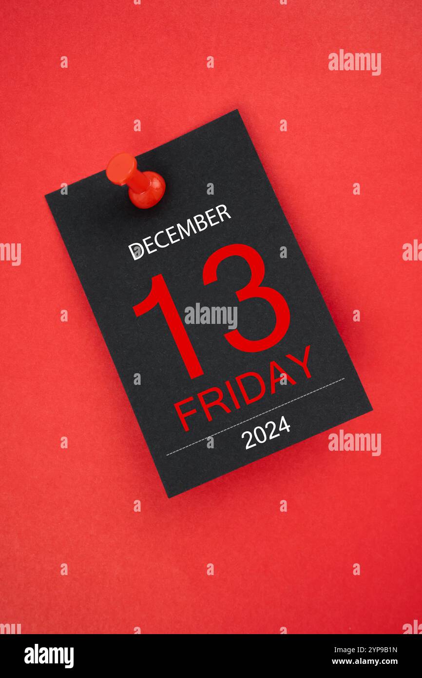 Calendar Friday the 13th December 2024 with push pin on red color ...