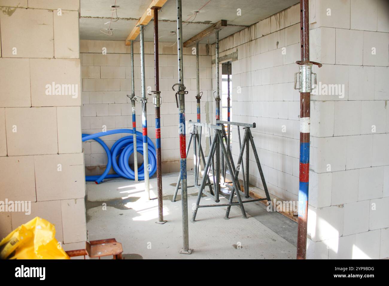 Inside view of a new building with white stone walls concrete and ...