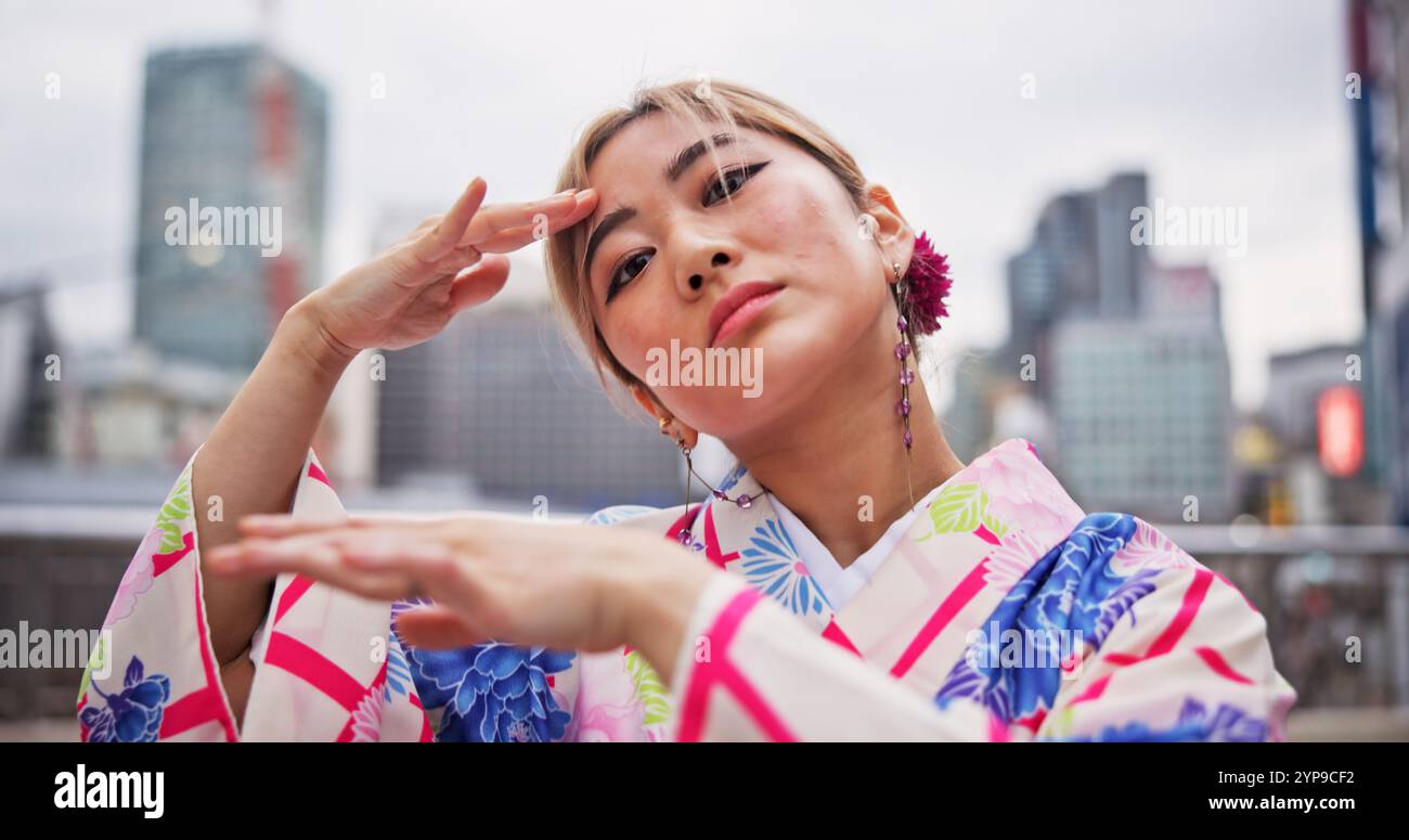 Japanese woman, culture and dance with kimono in city for hand movement ...