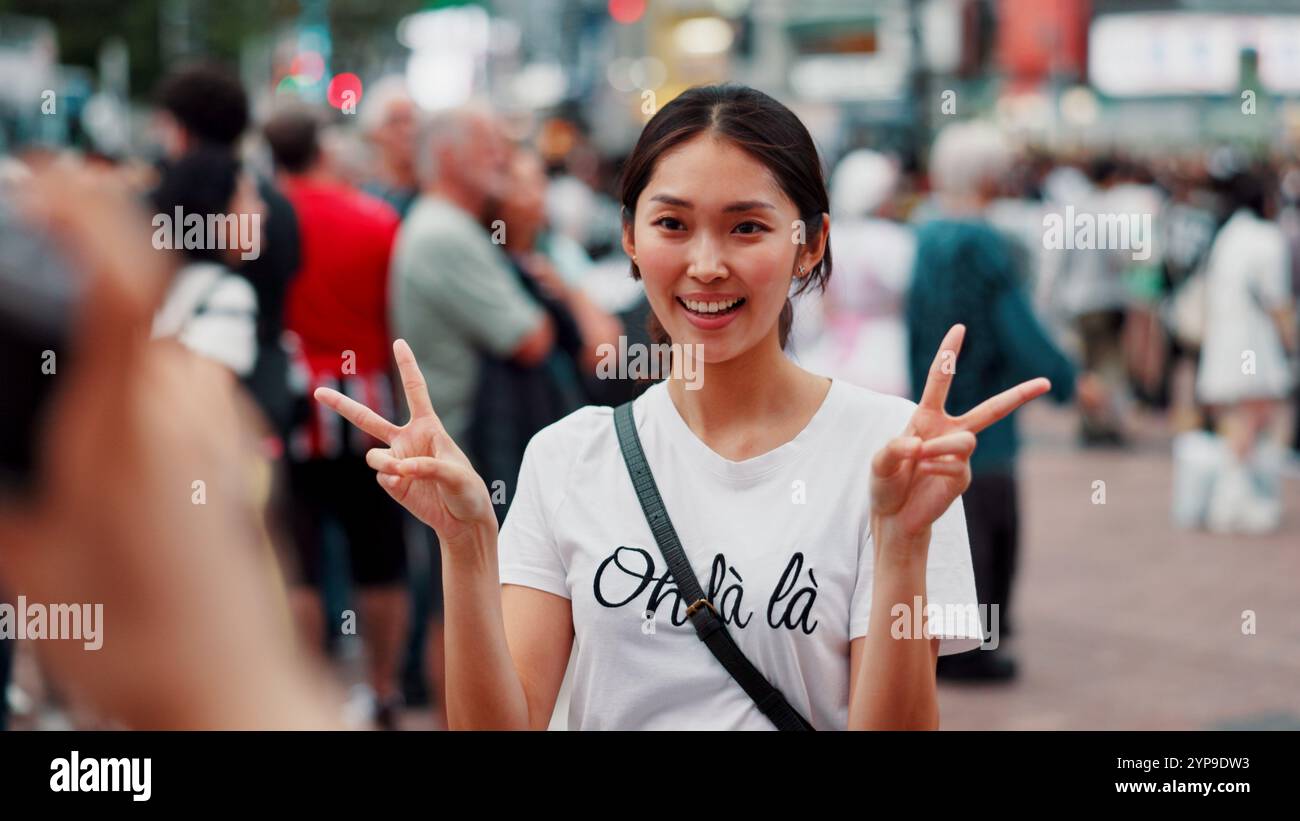 Tourist, woman and peace sign with photography in city for travel ...