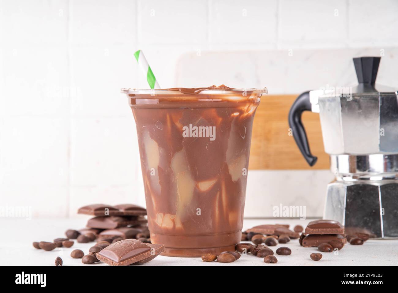 Viral Cracking Chocolate Latte drink. Plastic glass with cracked milk ...