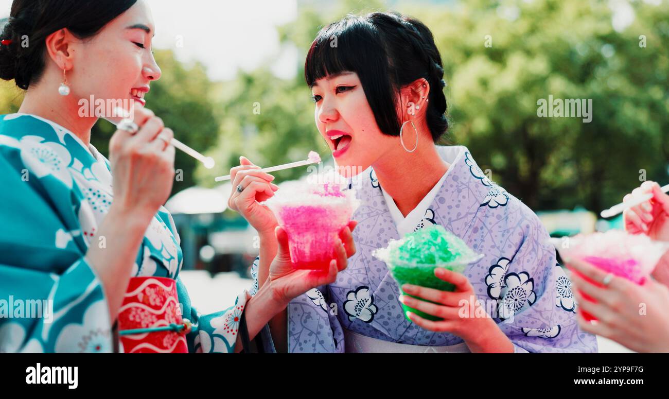 Kimono, sharing and slushy with Japanese women outdoor in city together ...