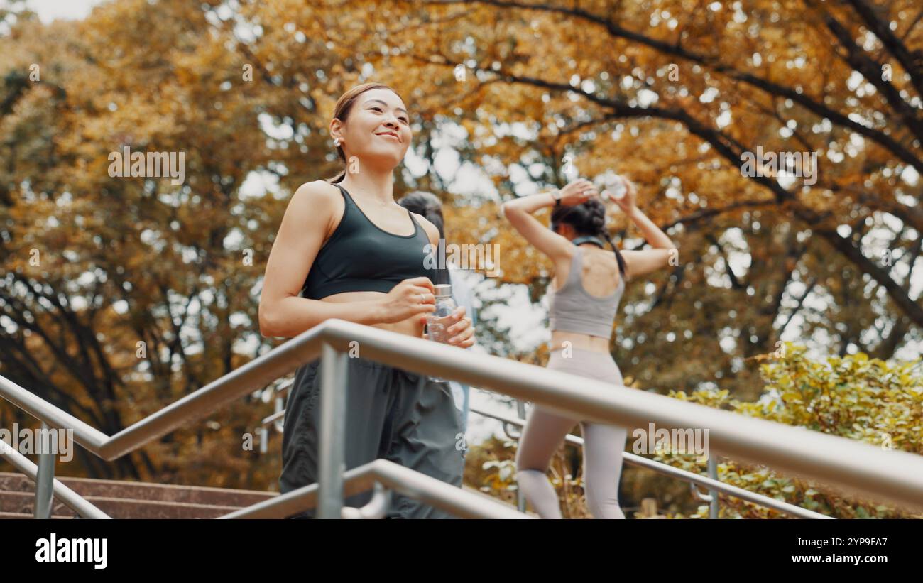 Happy, stairs and running with Japanese woman in city for health ...