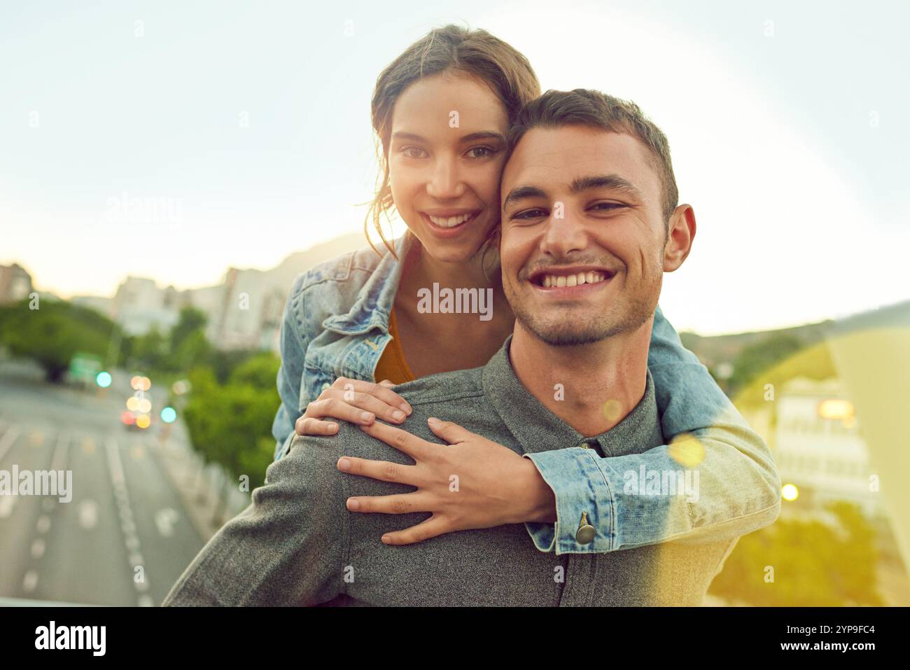 Portrait, couple and piggyback for love outdoor on vacation, honeymoon ...