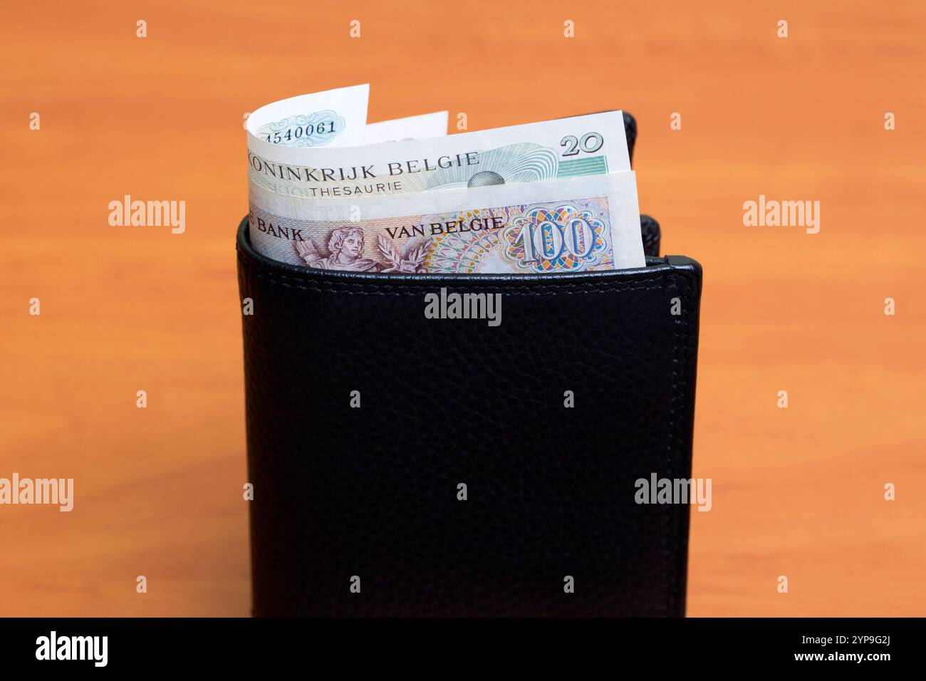 Old Belgian money - franc in the black wallet Stock Photo - Alamy